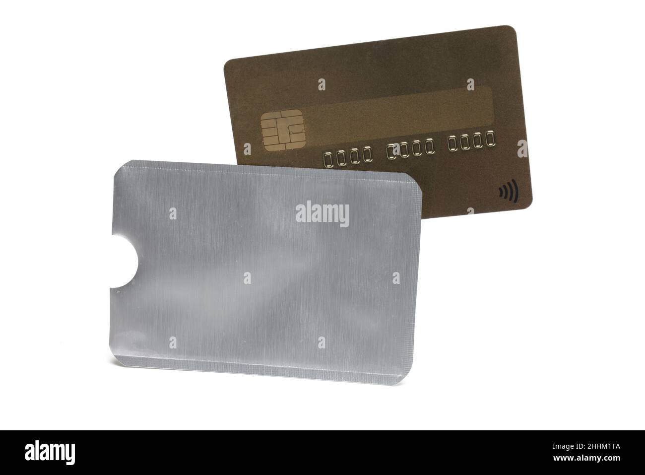 Close up of gold credit card behind silver cover to block RFID chip ...