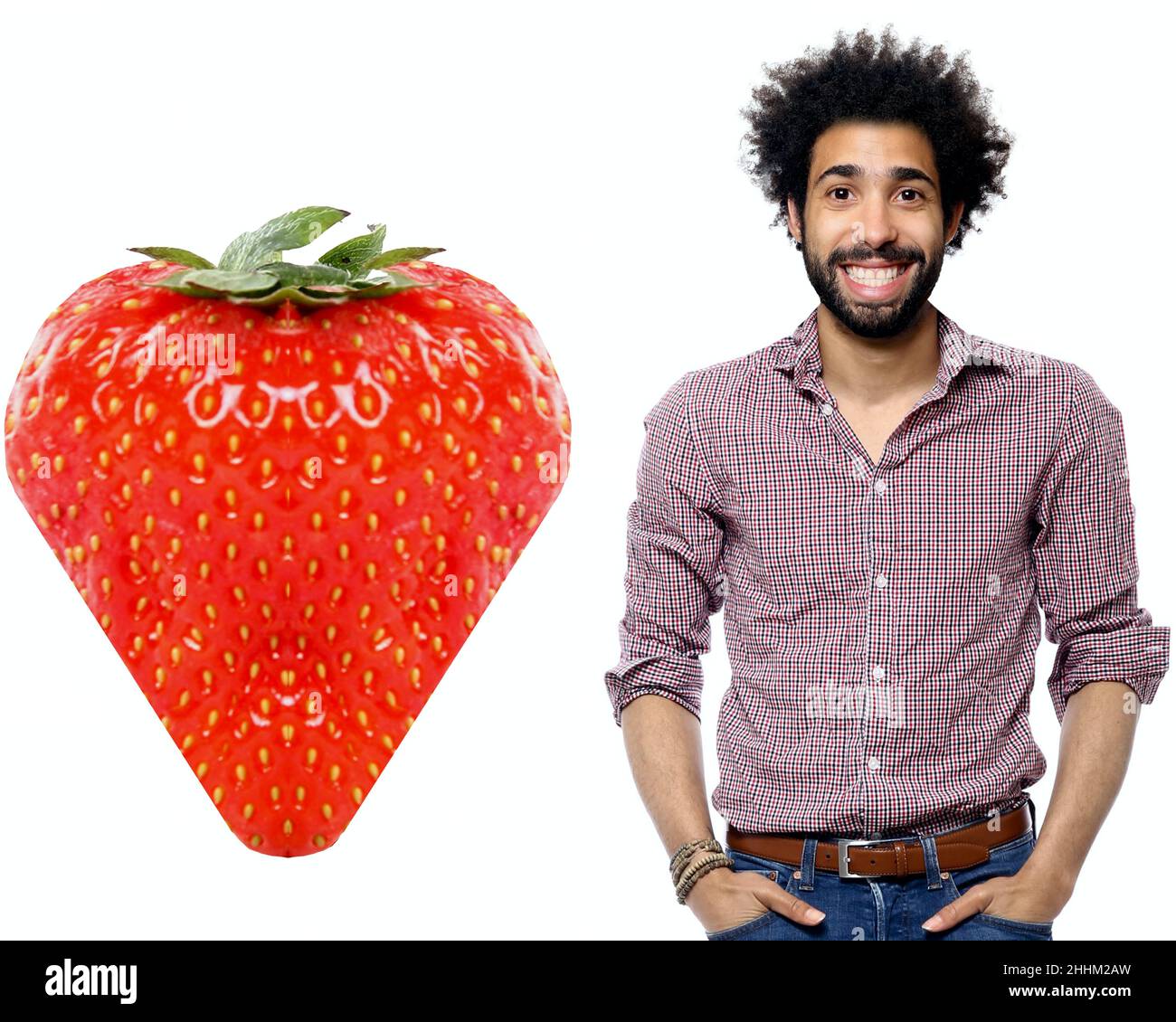 Beautiful man with a strawberry Stock Photo - Alamy