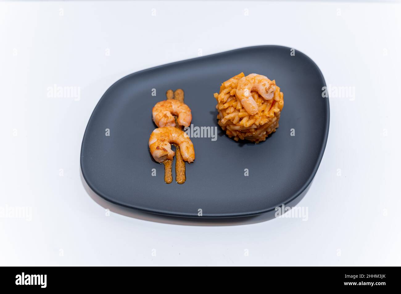 shrimp janapnese dish chinese sticks, fideua black dish Stock Photo - Alamy