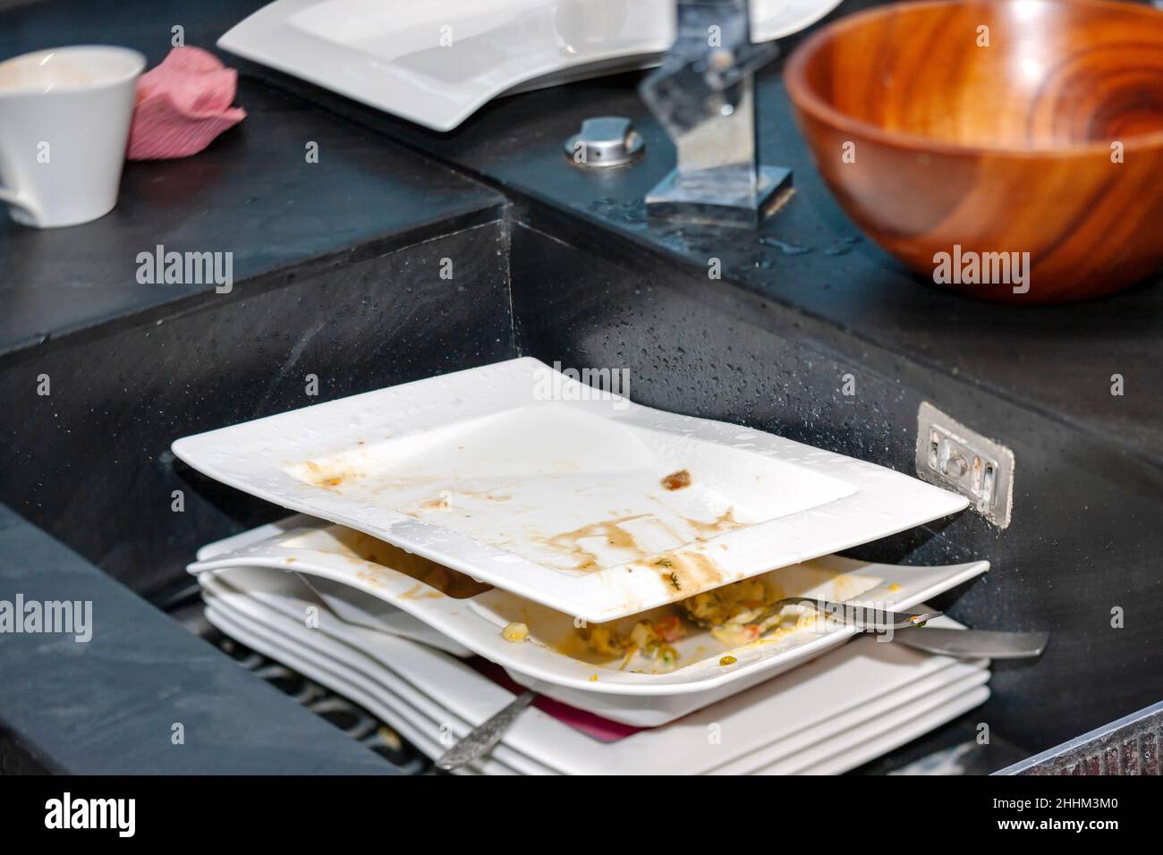 stack of dirty dishes after dinner in a kitchen sink, shallow DOF Stock ...