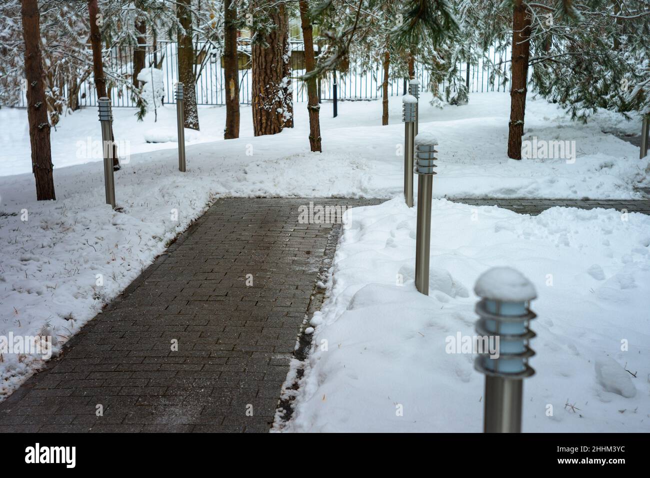 clean and gritted with salt tiled path, winter scene Stock Photo - Alamy