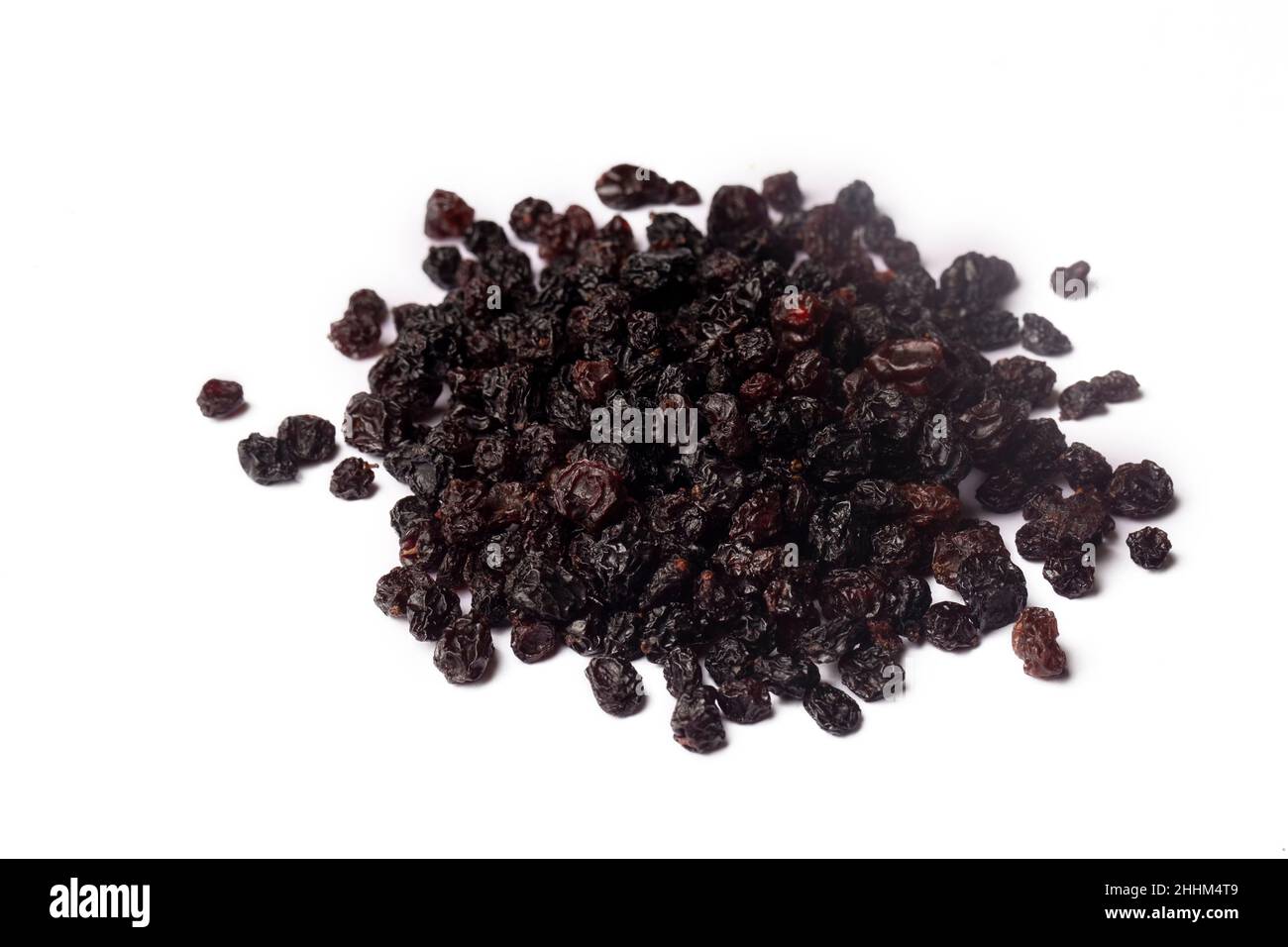 Dried currants on the white background Stock Photo - Alamy