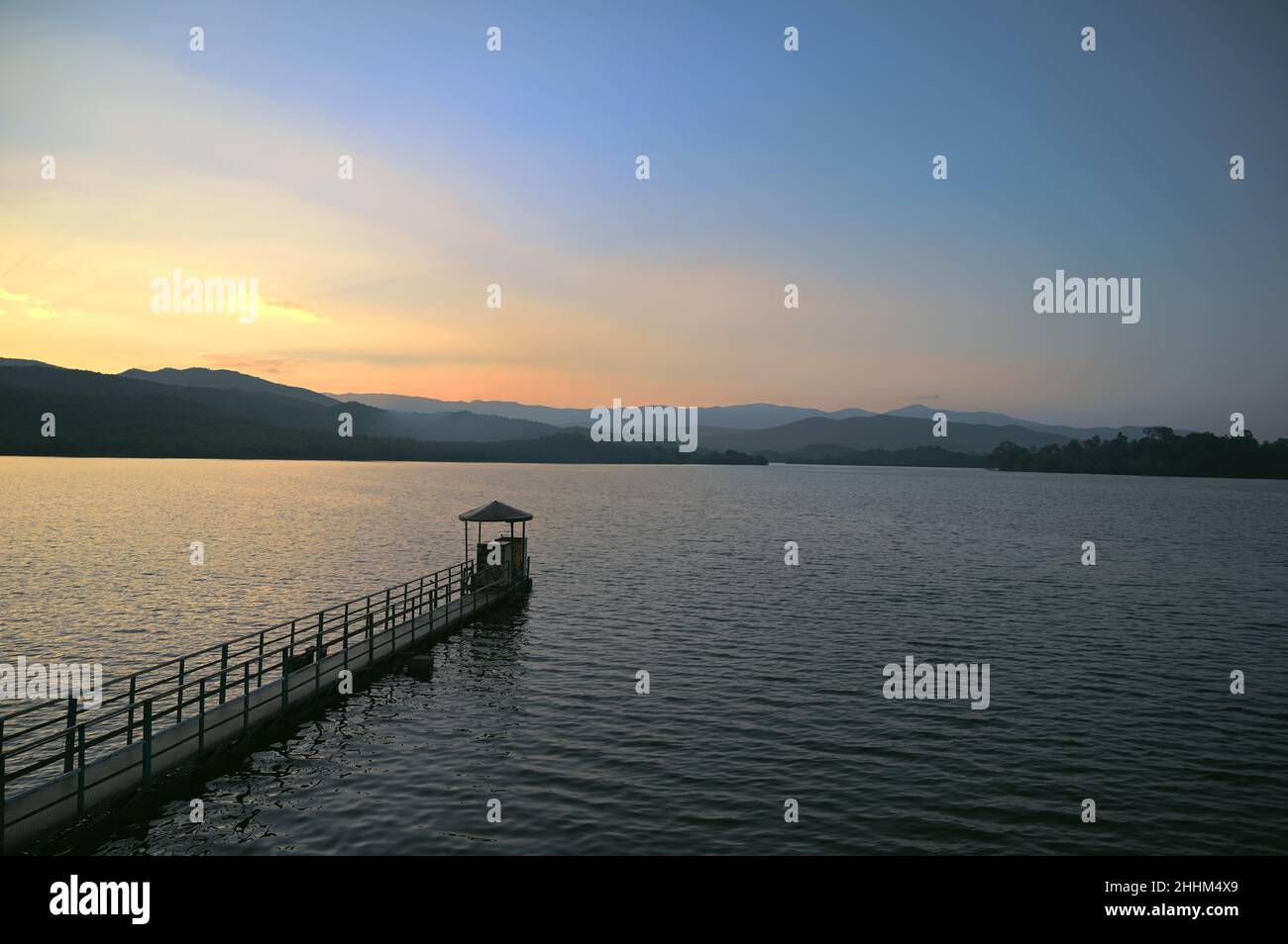 Sunset at a lake, Karnataka Stock Photo - Alamy