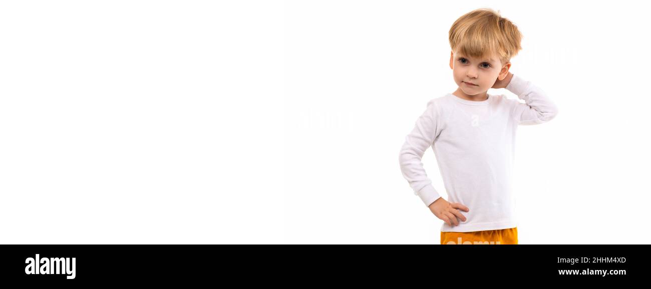thoughtful blond child scratching his head with his hand Stock Photo ...