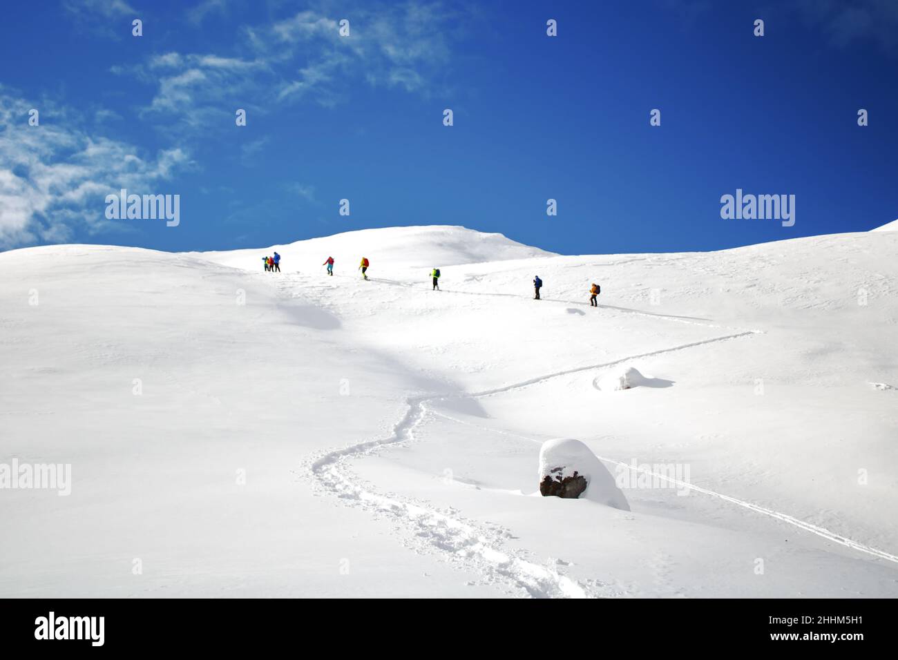 Group of people wear special climbing gear on a mountain Stock Photo ...