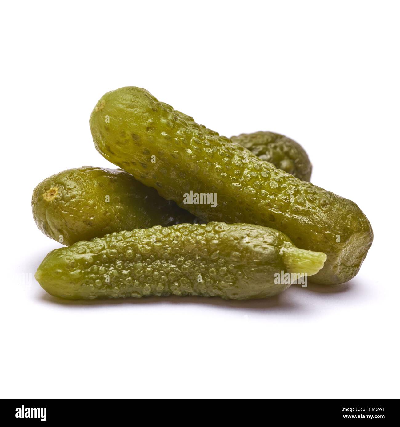 Tasty Whole green cornichons isolated on a white background Stock Photo ...
