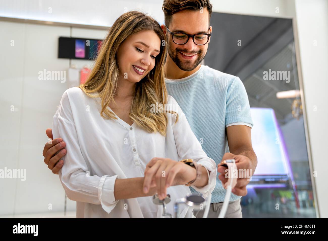 Technology people smart devices concept. Happy couple buying new smart ...