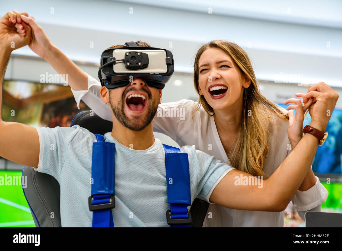 Portrait of happy people having fun with virtual reality glasses ...