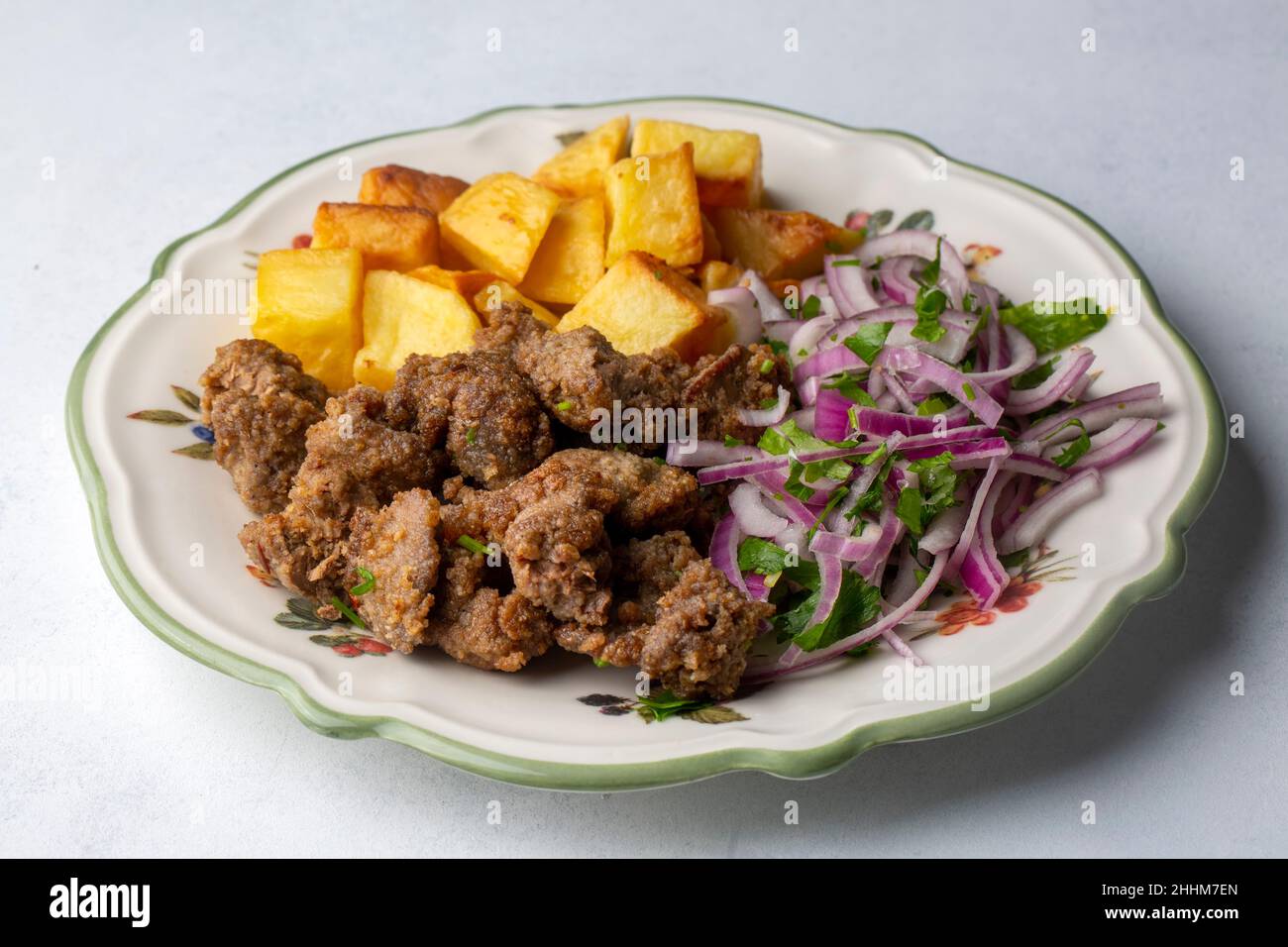 Liver pan (Albanian liver) Turkish traditional food. Liver over rice ...