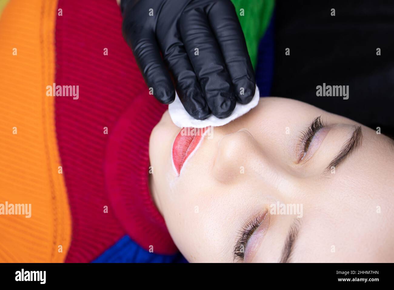 permanent lip tattooing procedure the master wipes the remnants of ...