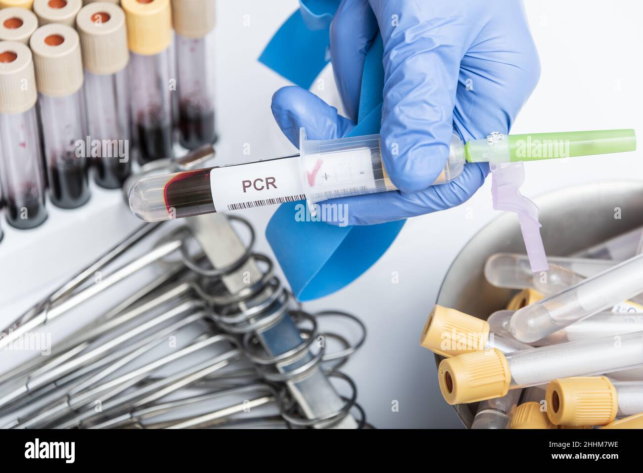 Scientists hand holding a test-tube with blood sample for PCR test ...