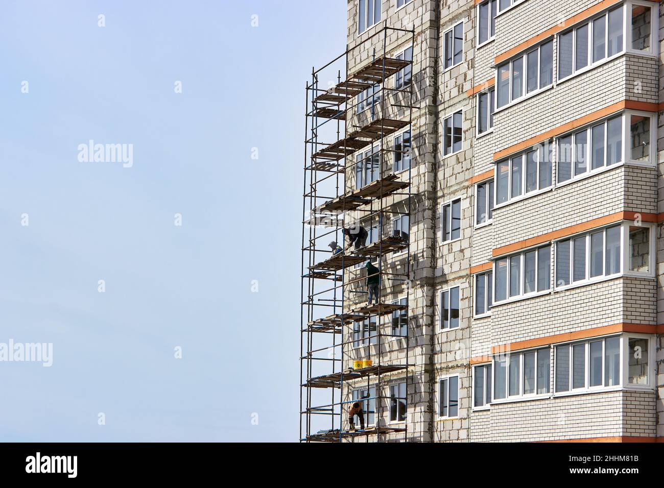 Builders work without means of protection, insurance. Construction of a ...