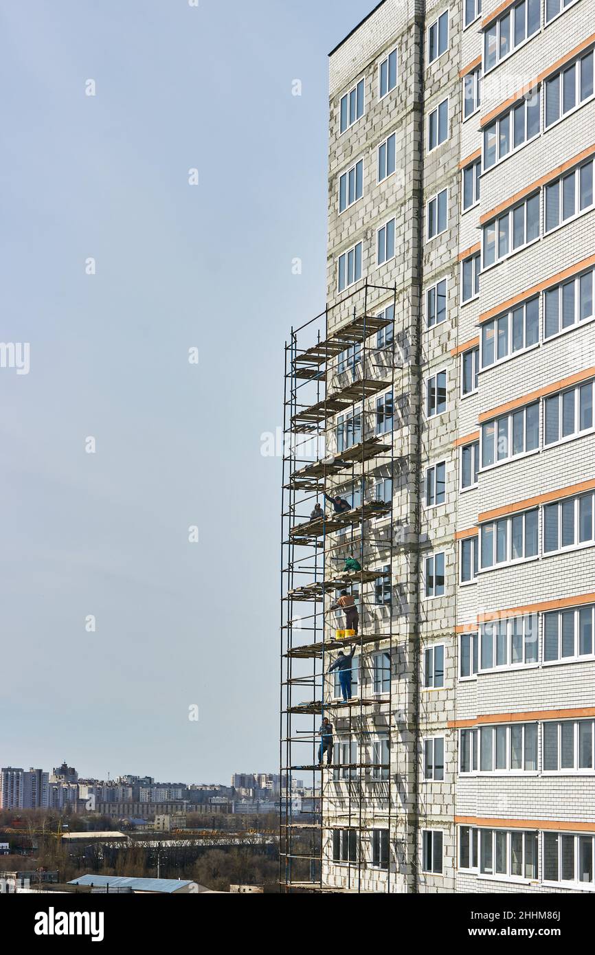 Builders work without means of protection, insurance. Installation of ...