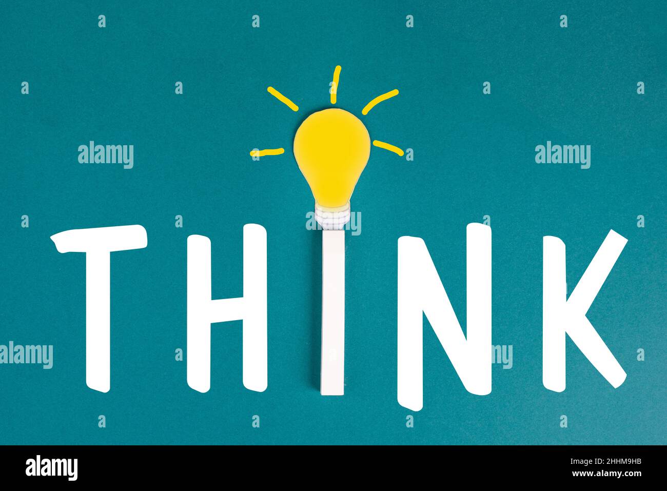 The word think is standing on a petrol colored background, light bulb ...