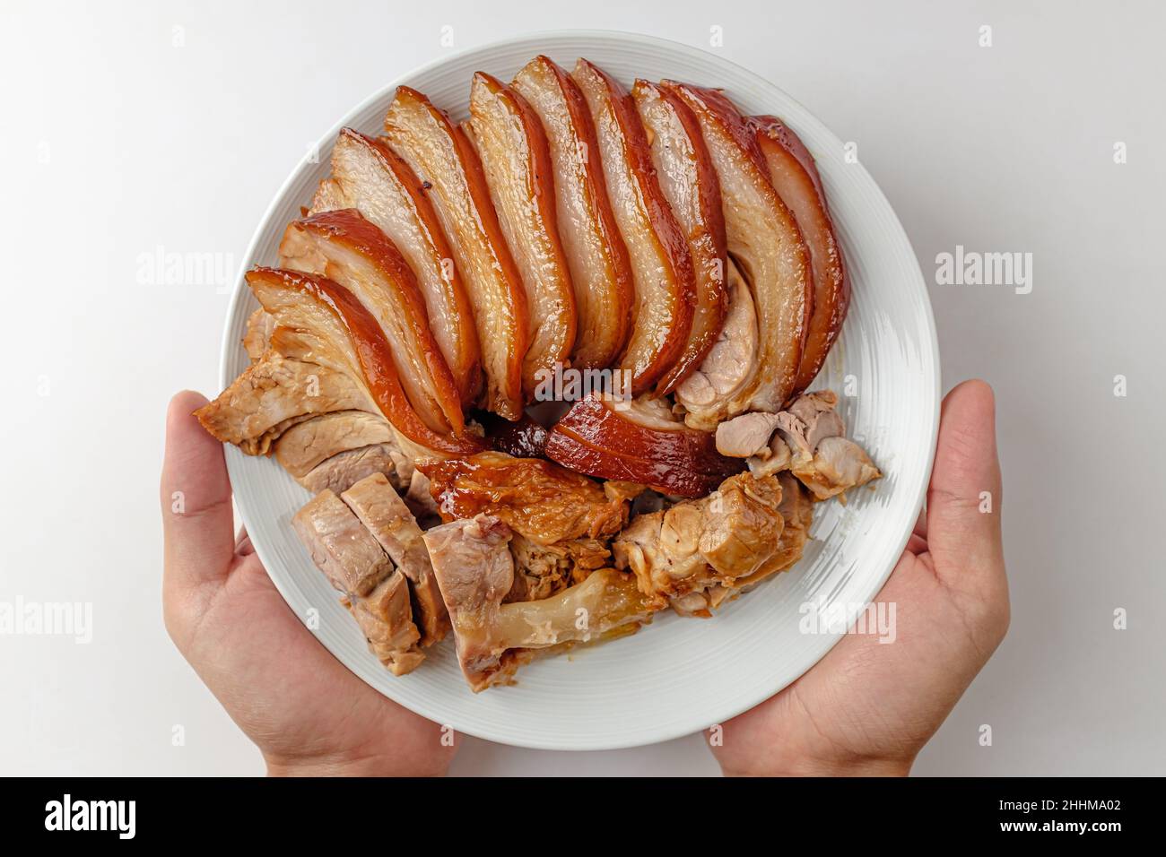 cooked pork feet on a white background Stock Photo - Alamy