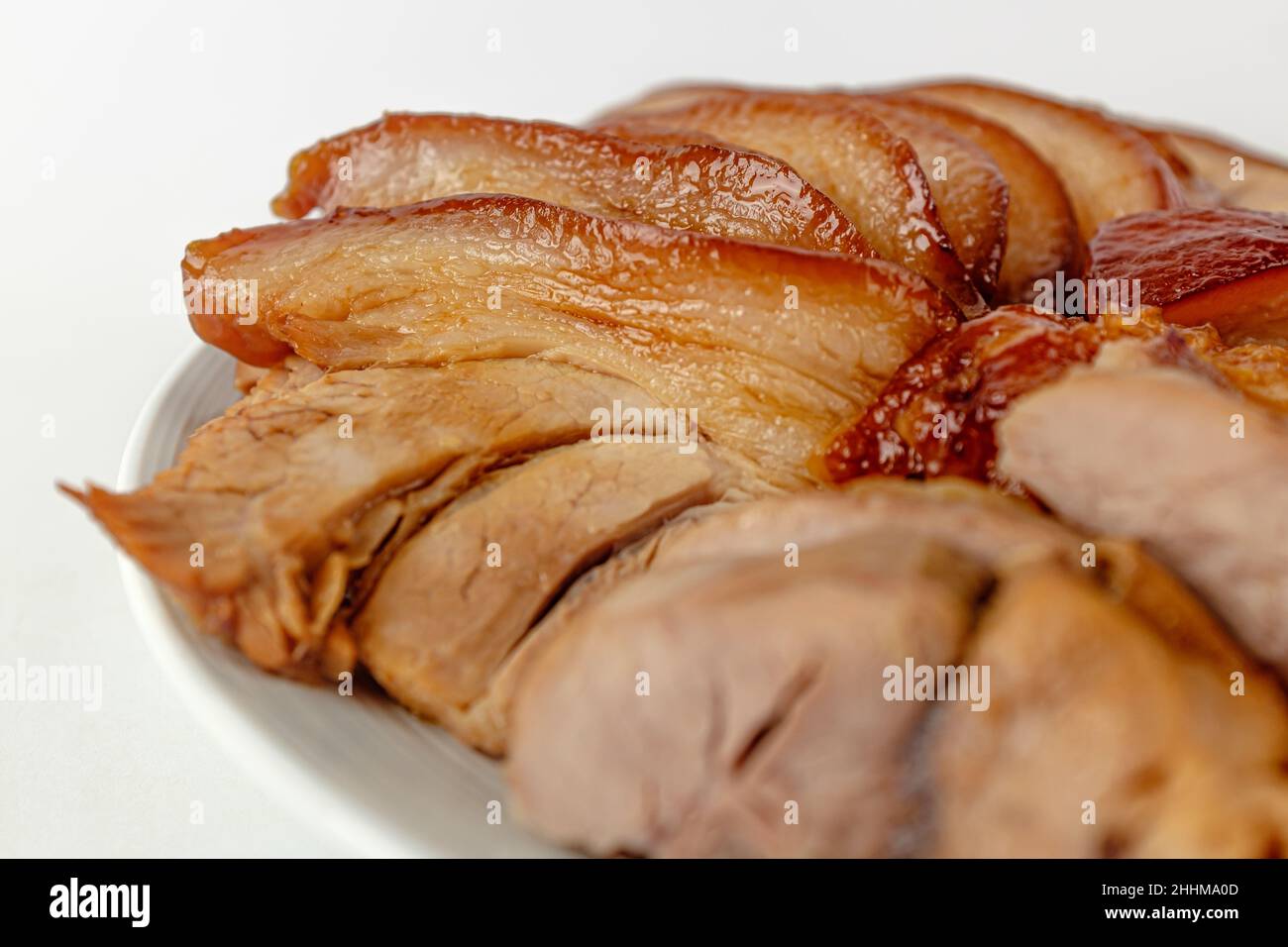 cooked pork feet on a white background Stock Photo - Alamy