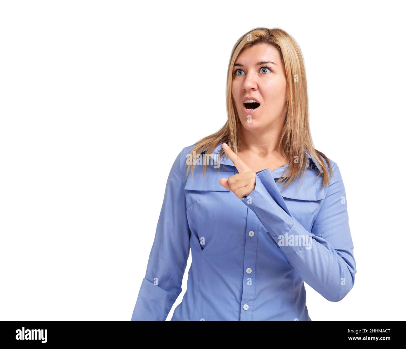 Surprised young woman showing index finger in copy space isolated on ...