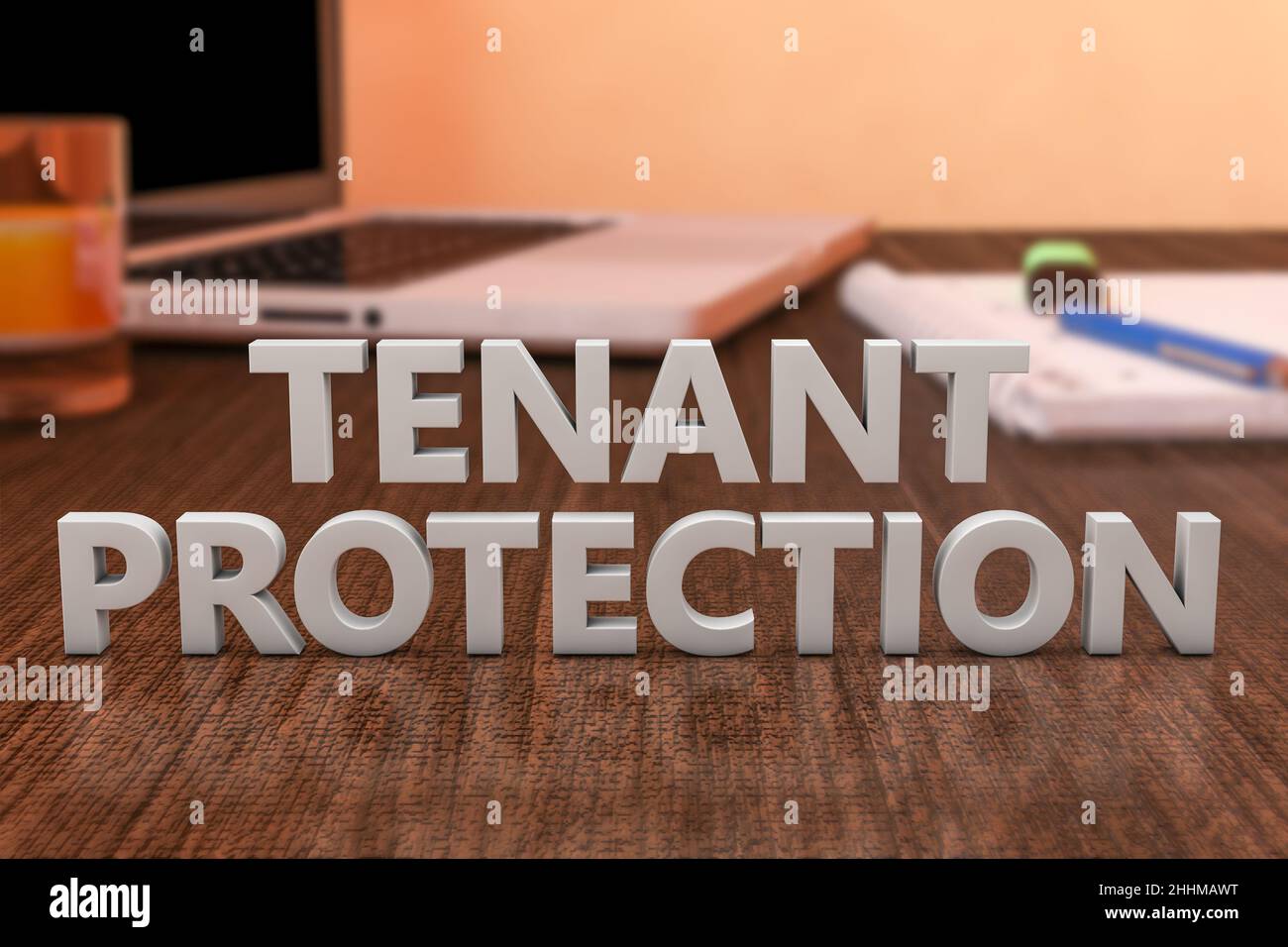 Tenant Protection - letters on wooden desk with laptop computer and a ...