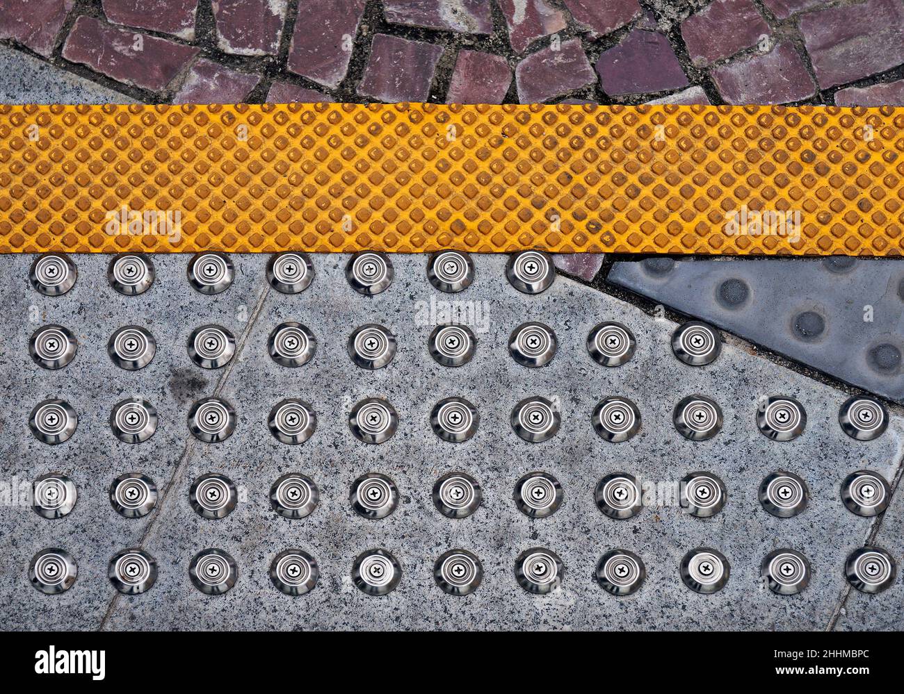 Warning bumps for blind people on sidewalk Stock Photo - Alamy