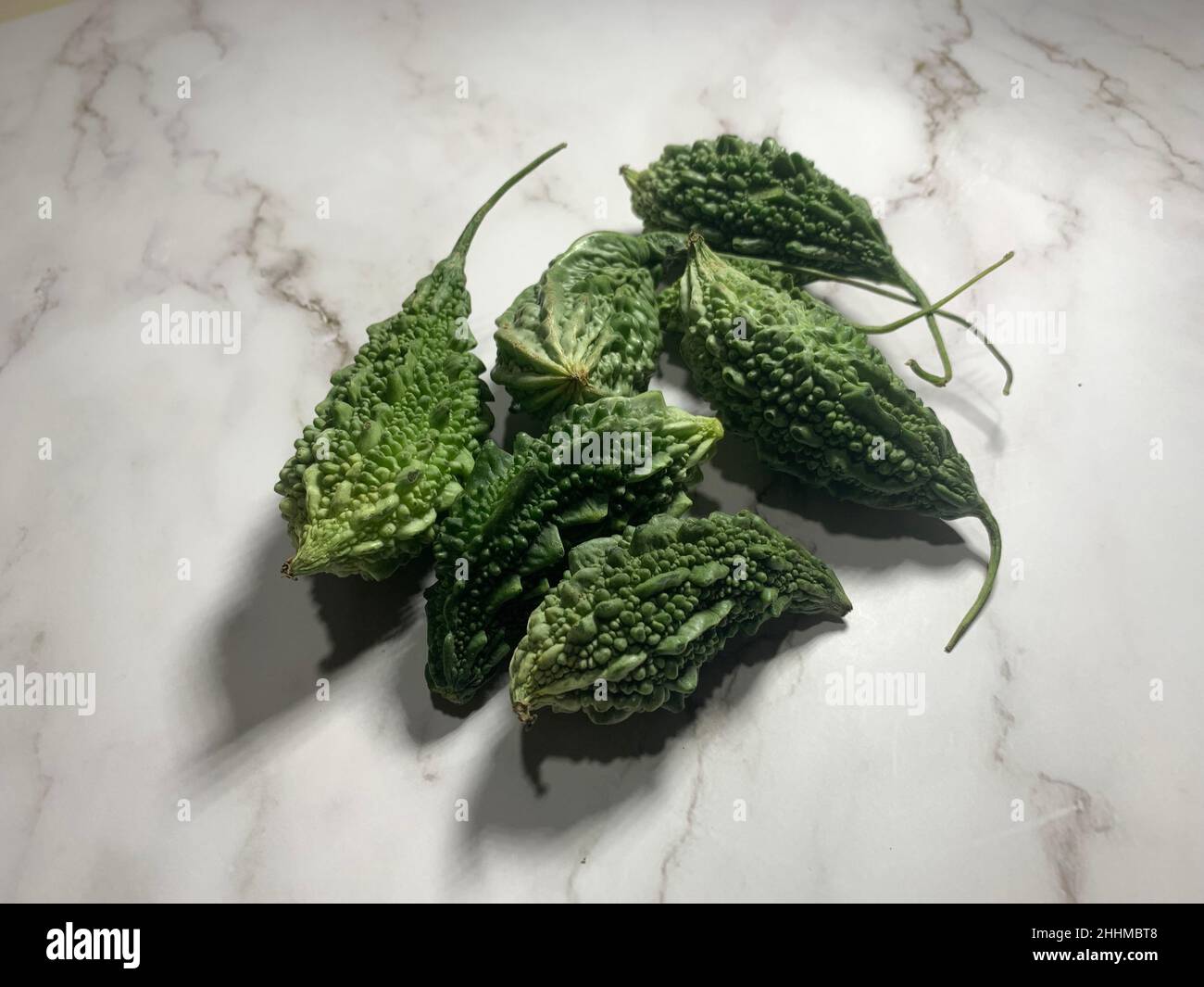 Bitter melon and Bitter gourd. Green Vegetables Concept Stock Photo - Alamy