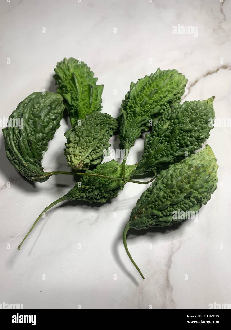 Bitter melon and Bitter gourd. Green Vegetables Concept Stock Photo - Alamy