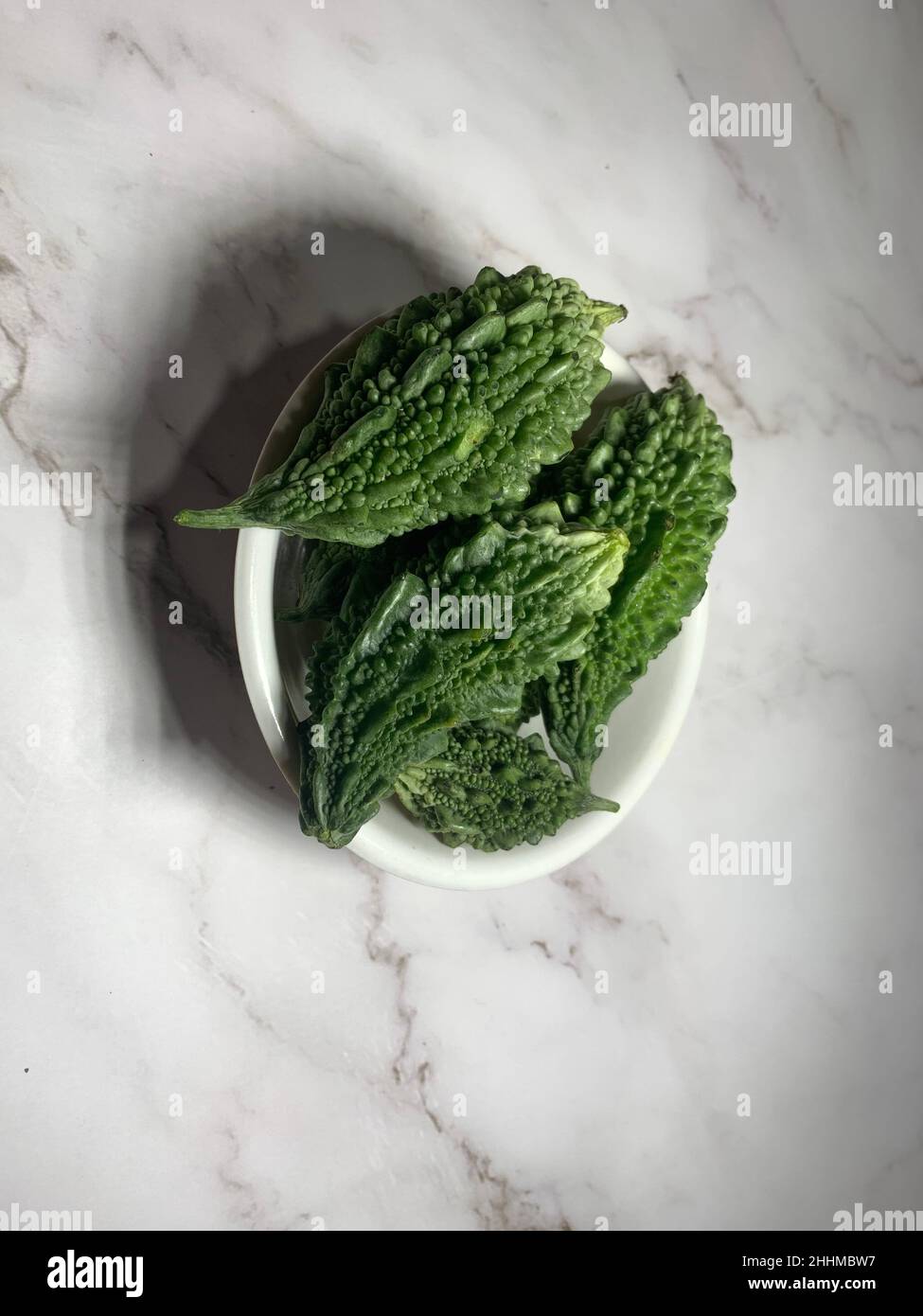 Bitter melon and Bitter gourd. Green Vegetables Concept Stock Photo - Alamy