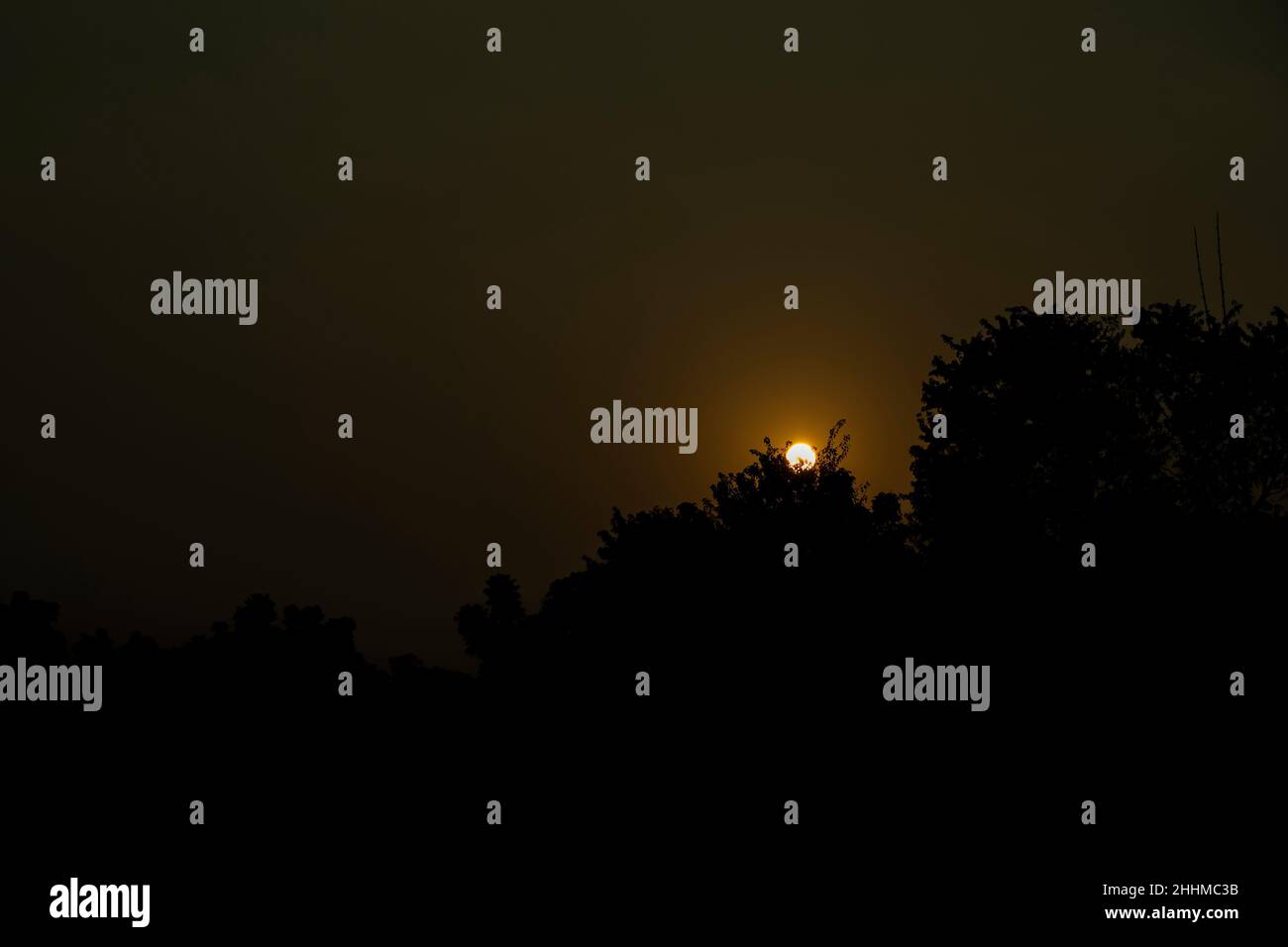 Sun almost sets just before dusk that time the golden radiant light is ...