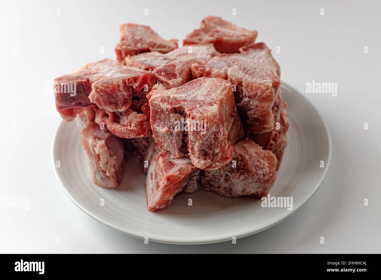 pork backbone on a white background Stock Photo - Alamy