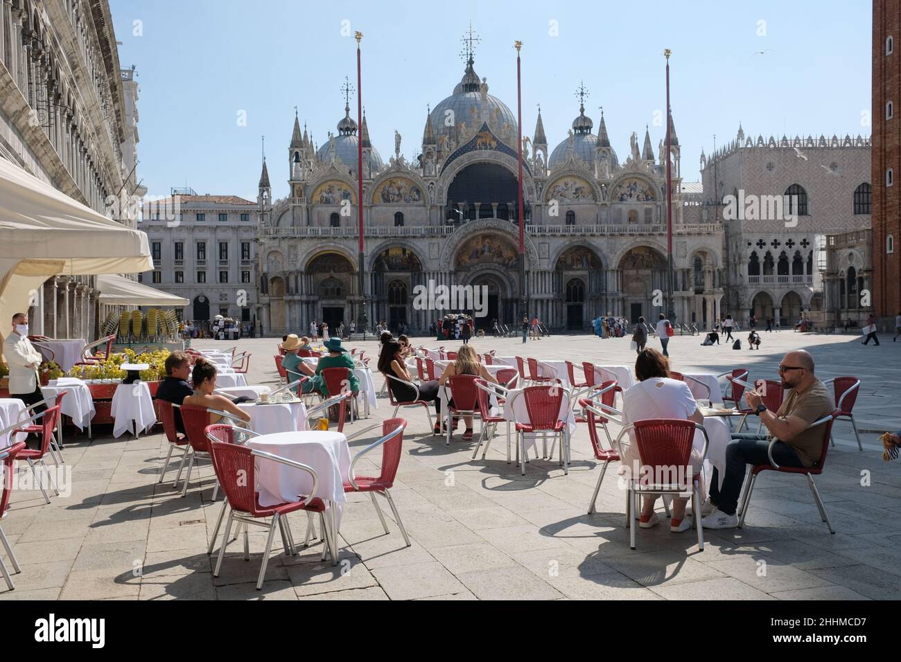 Tourists are seen at the Caffe Quadri at St. Mark's Square in Venice ...
