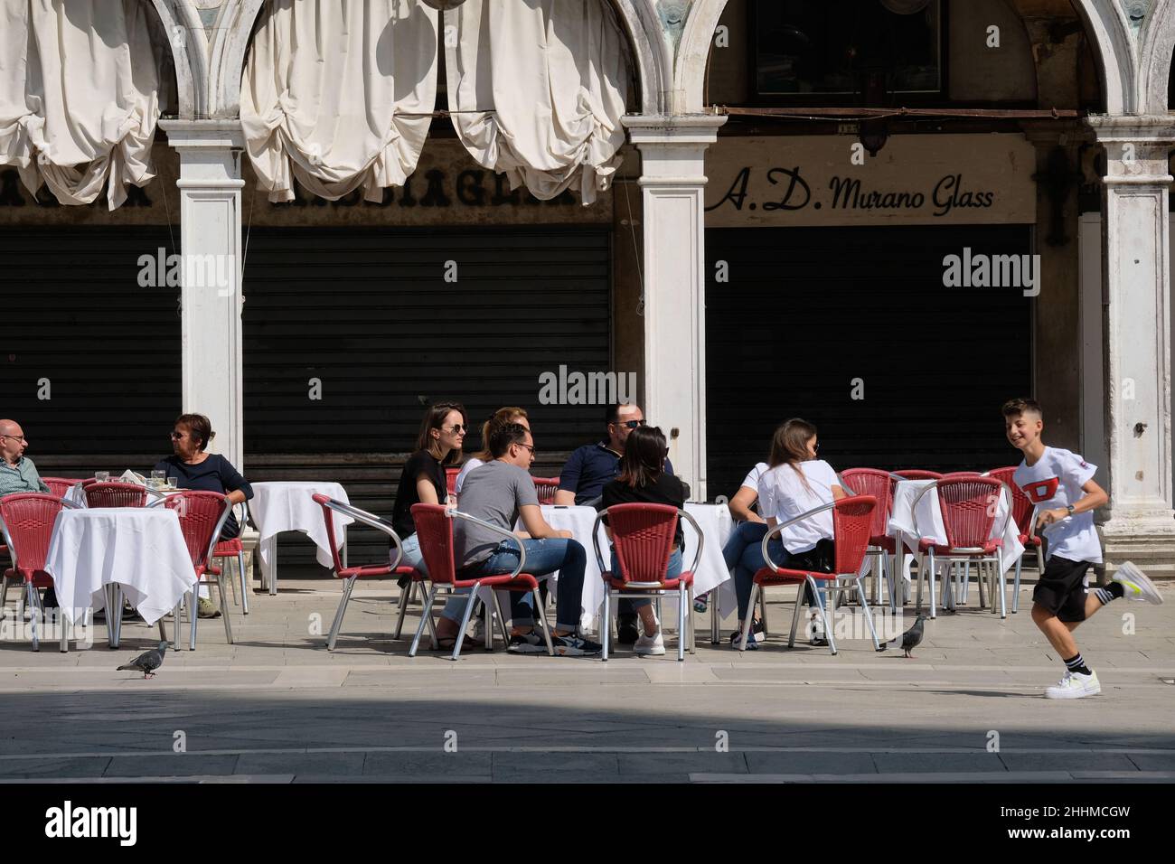 Tourists are seen at the Caffe Quadri at St. Mark's Square in Venice ...