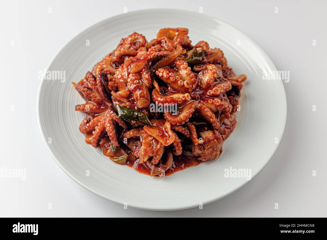 Stir-fried Webfoot octopus on a white background Stock Photo - Alamy