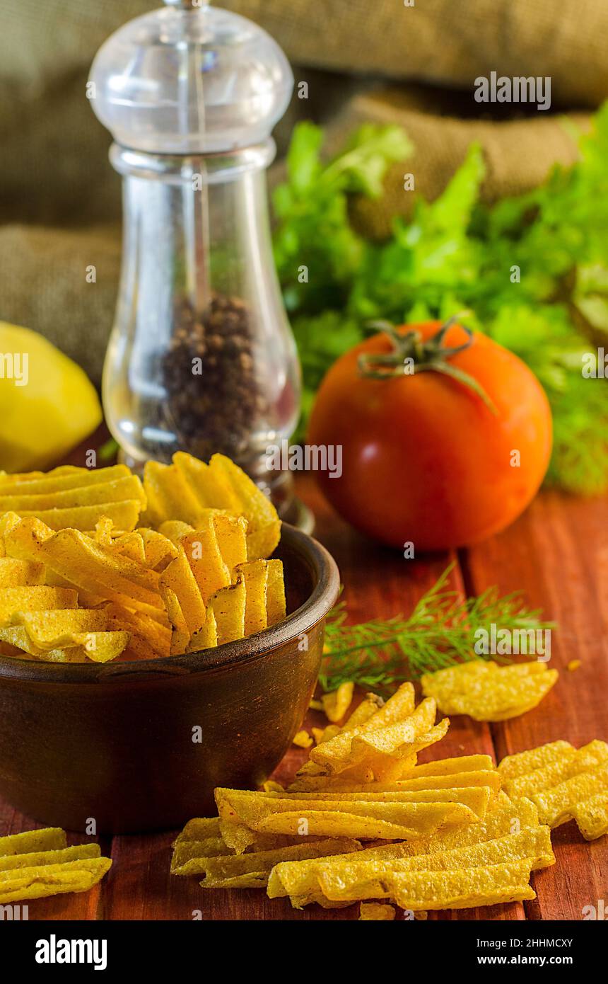 fried potato chips on the table and ingredients Stock Photo - Alamy