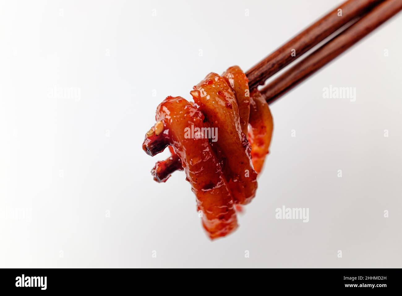 pickled squid on a white background Stock Photo - Alamy