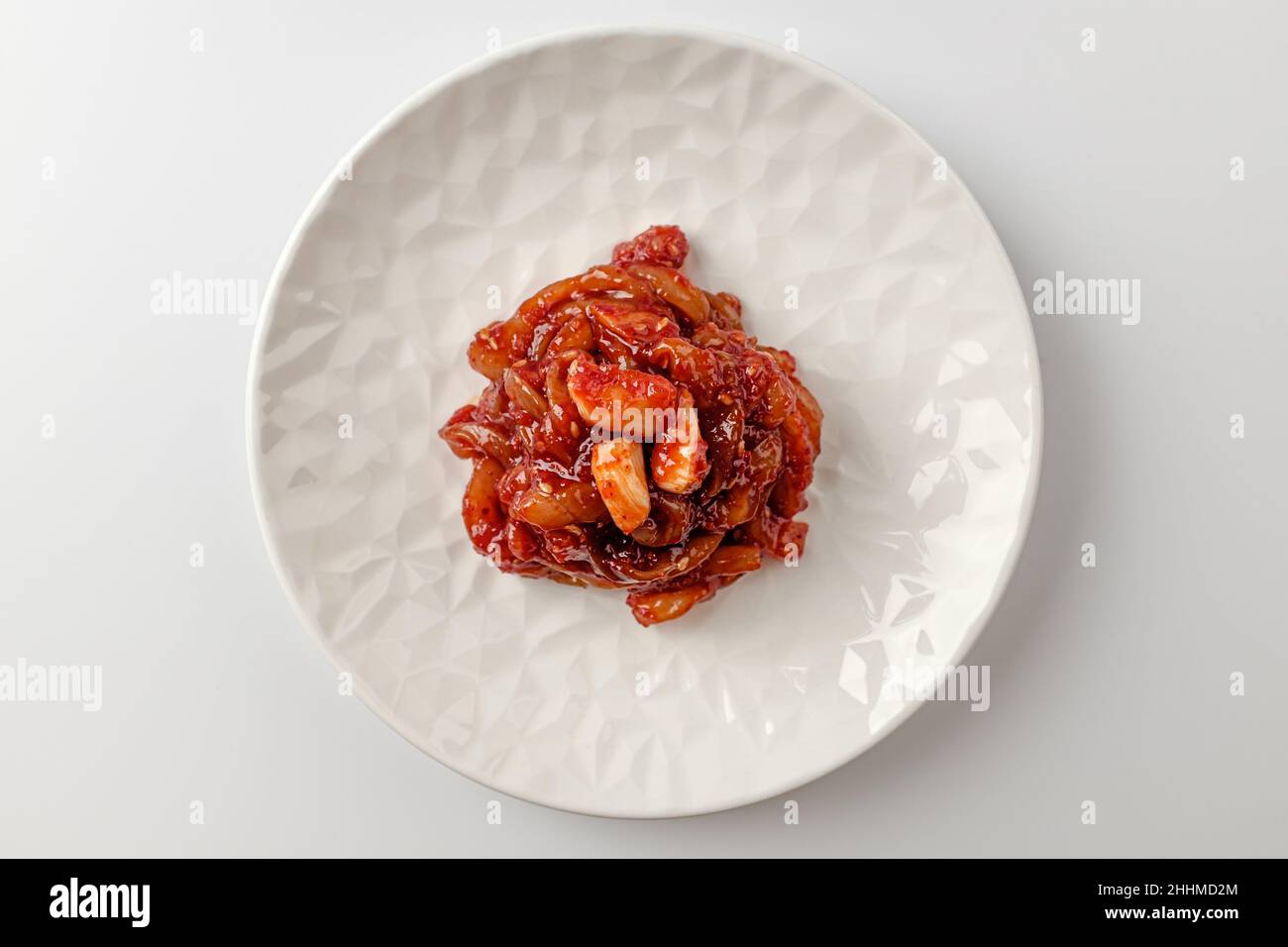 pickled squid on a white background Stock Photo - Alamy