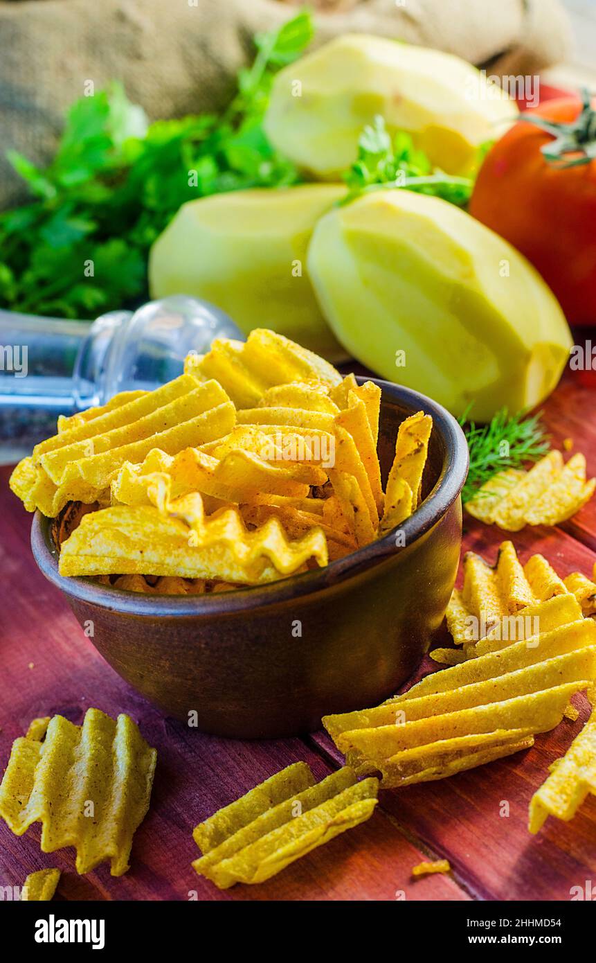 fried potato chips on the table and ingredients Stock Photo - Alamy