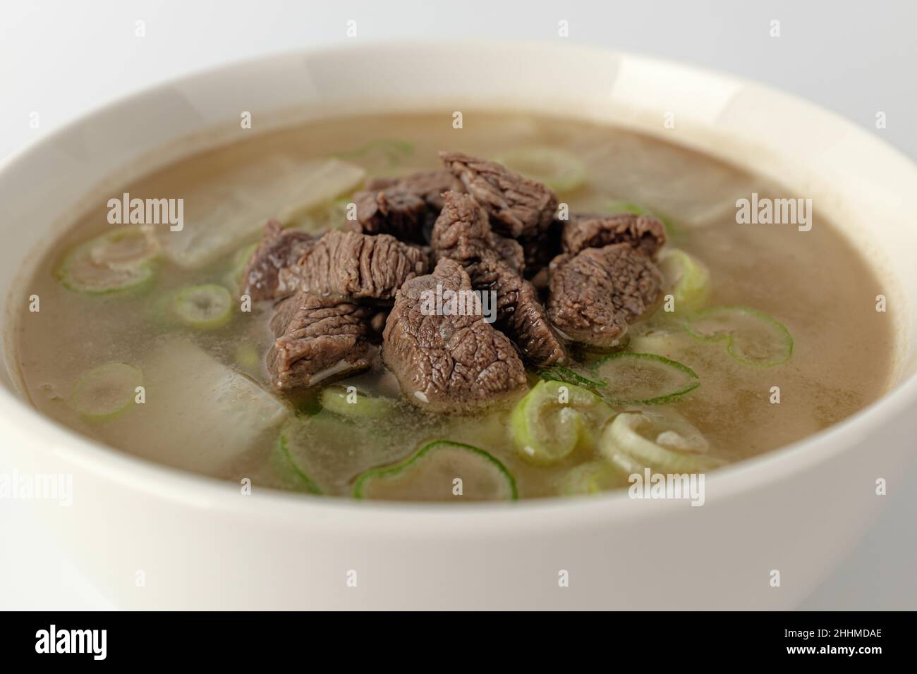 Beef radish soup on a white background Stock Photo - Alamy