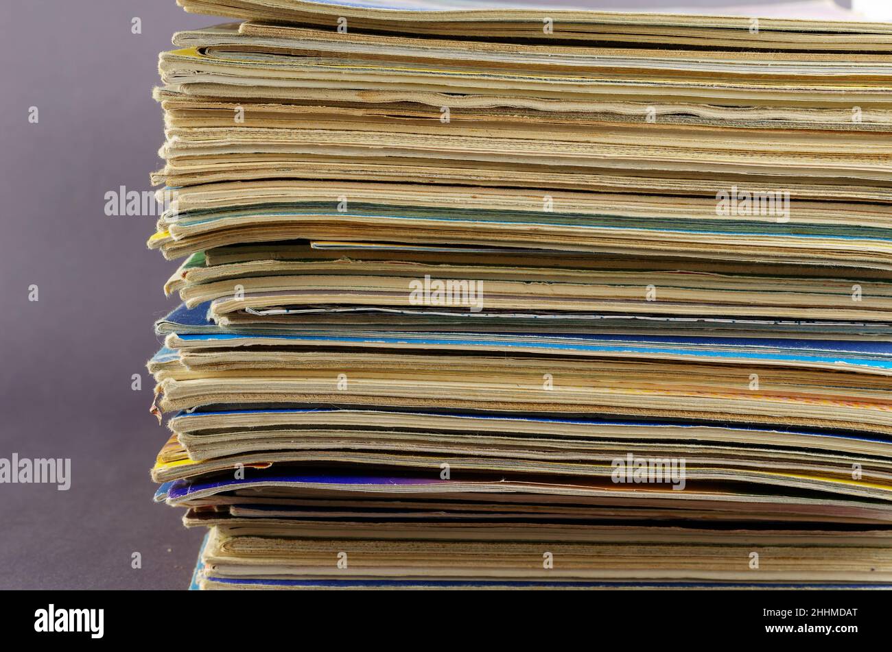 Collection of old comics and magazines against a gray background. Lots ...