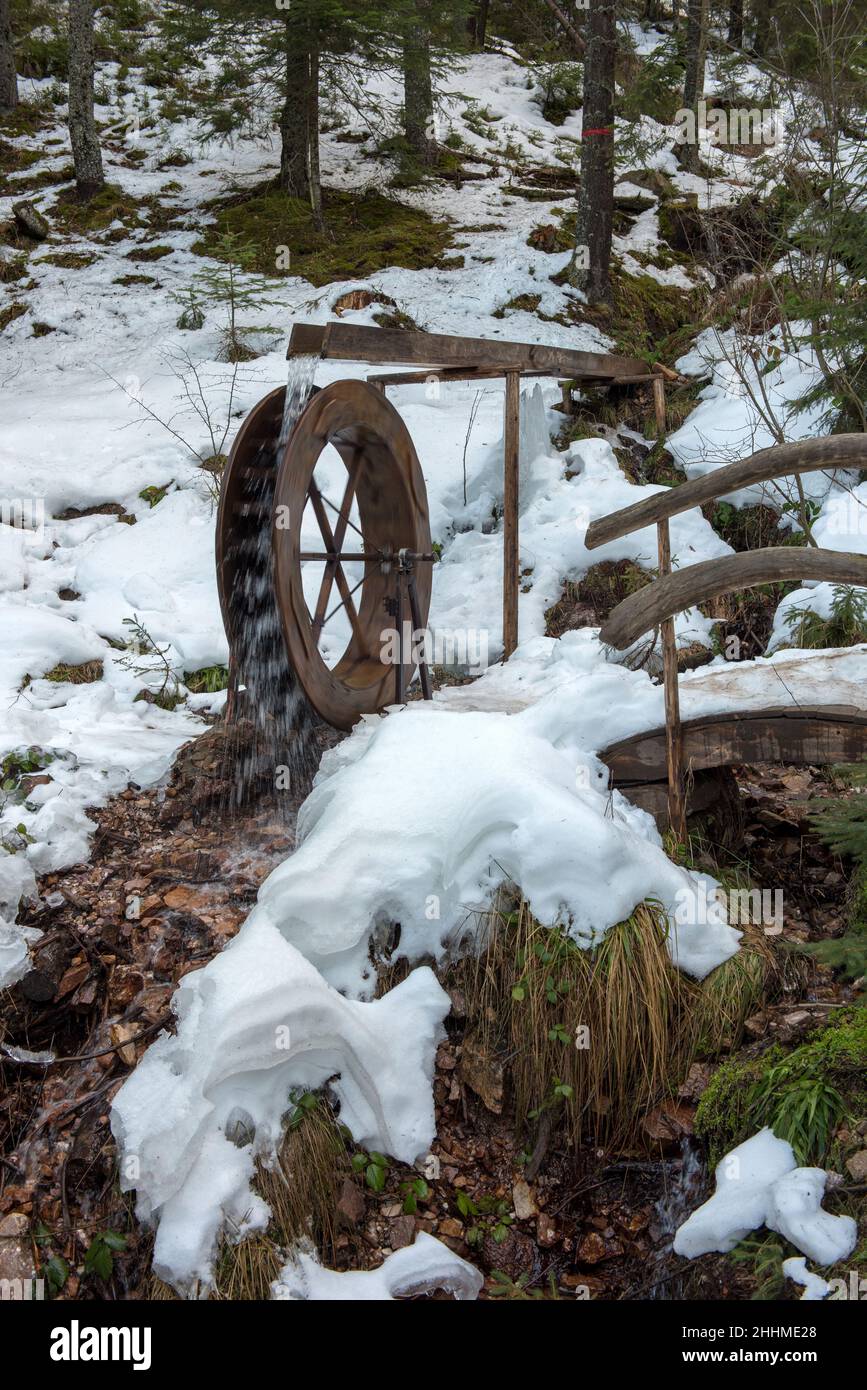 Wooden water wheel in the forest at winter Stock Photo - Alamy