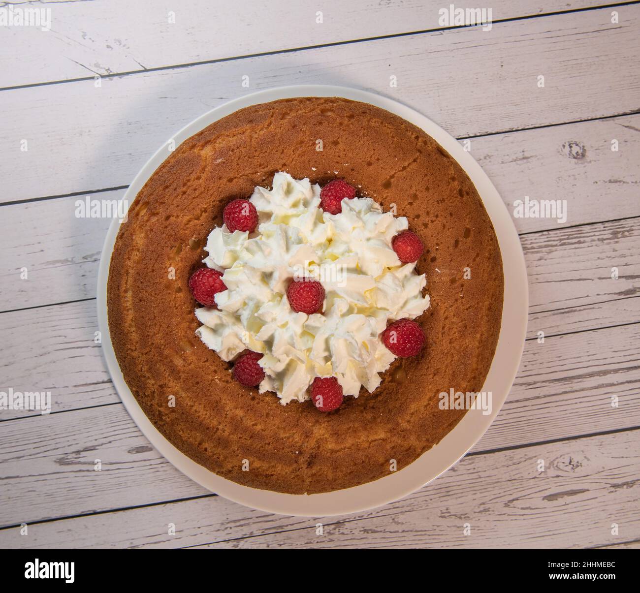 Pastry, Traditional Italian rum cake with whipped cream and raspberries ...