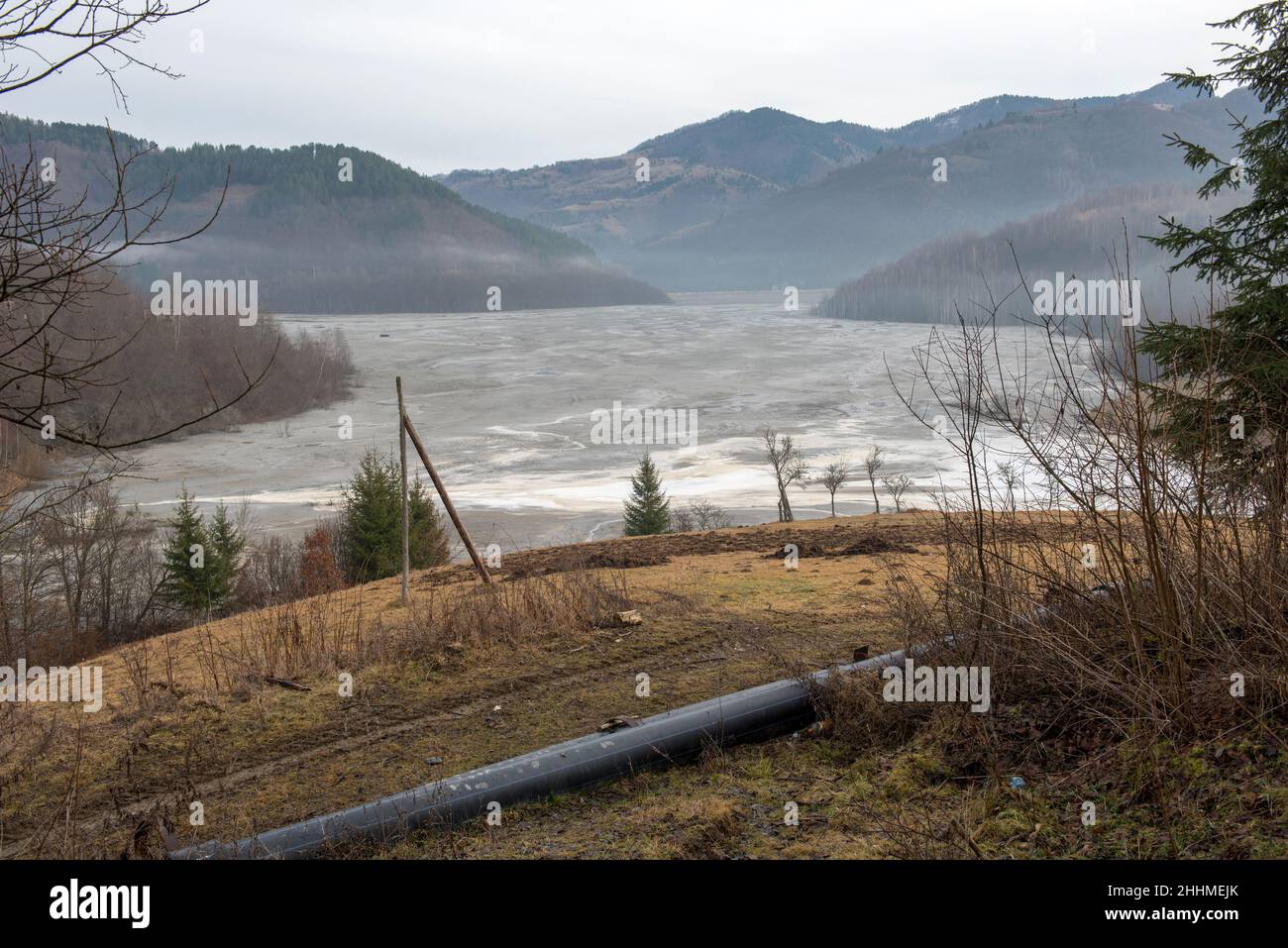 Muddy waters in a gigantic decantation pond. Toxic residuals from a ...