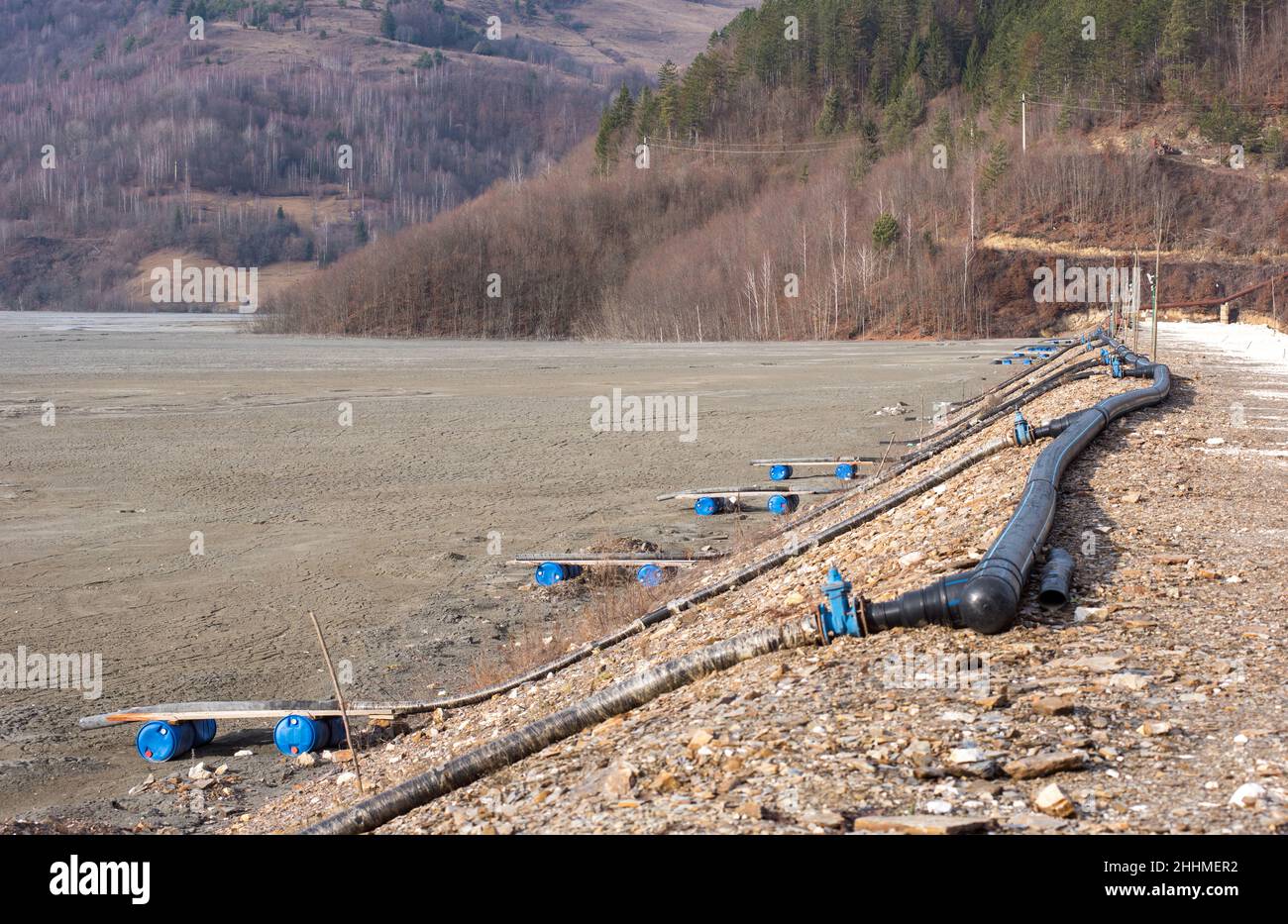 Decanting lake pipe installation treatment with lime and gypsum for ...