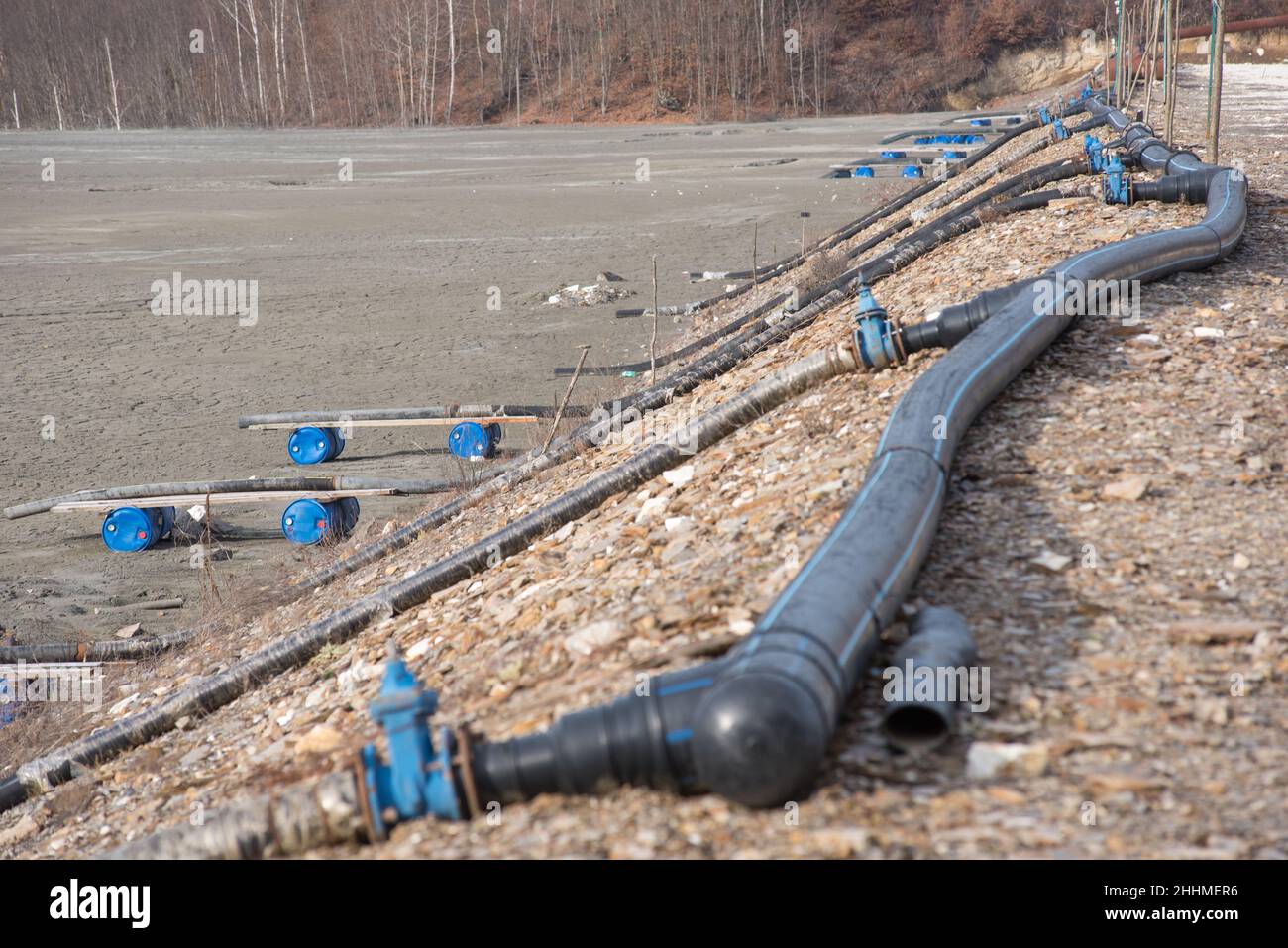 Decanting lake pipe installation treatment with lime and gypsum for ...