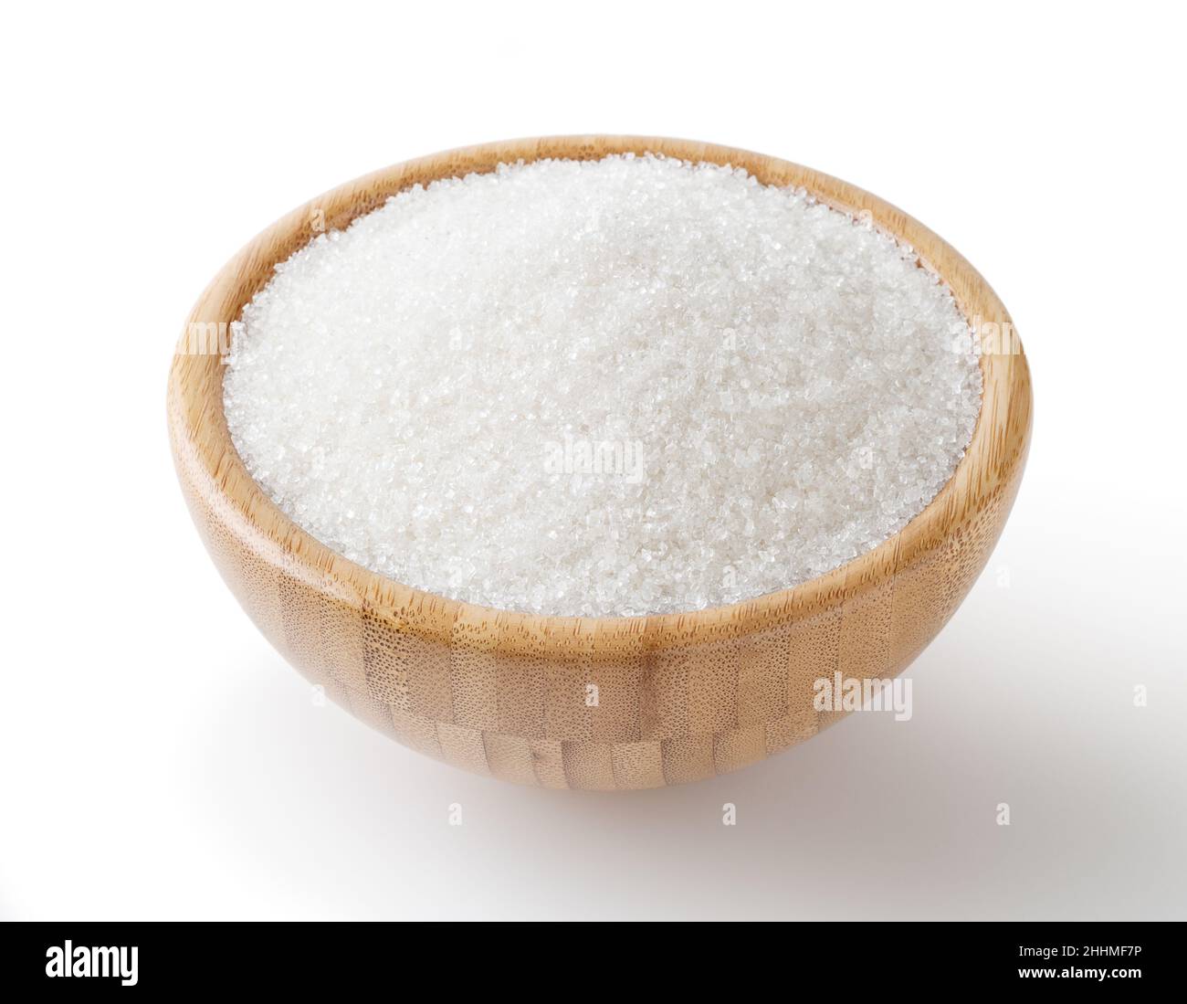 Granulated white sugar in wooden bowl isolated on white background with ...