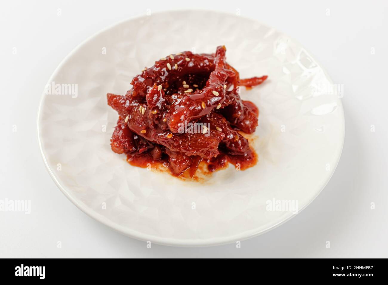 seasoned deodeok on a white background Stock Photo - Alamy