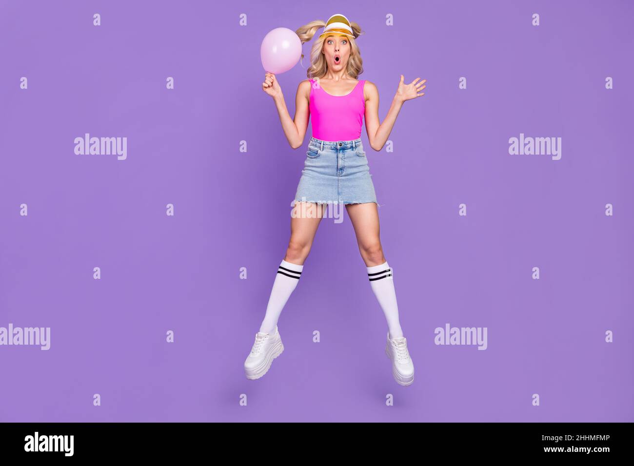 Full body photo of young girl amazed shocked surprised jump hold air ...