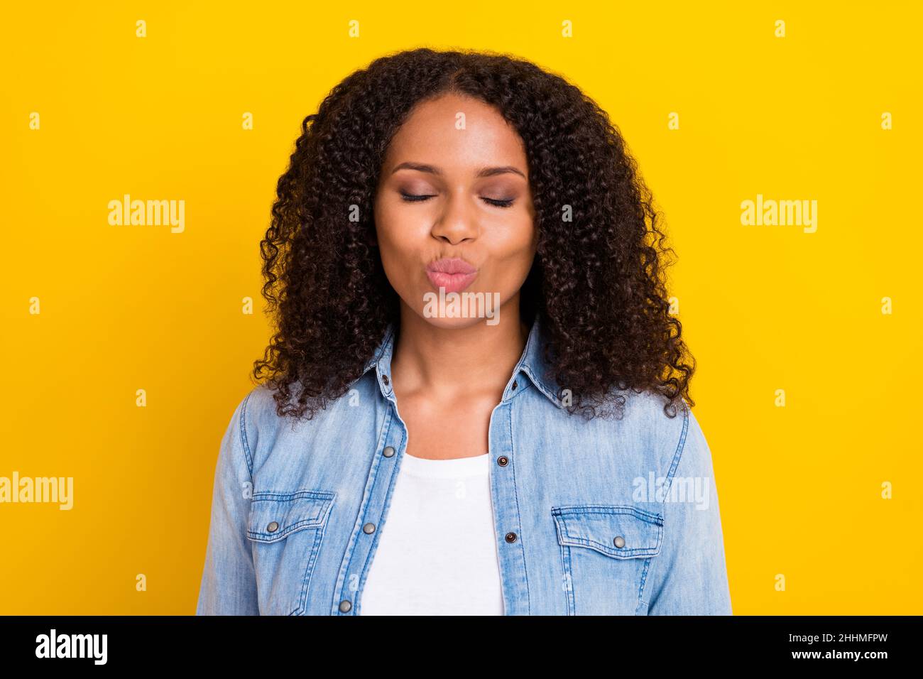 Photo of young happy flirty dark skin woman send air kiss face enjoy ...