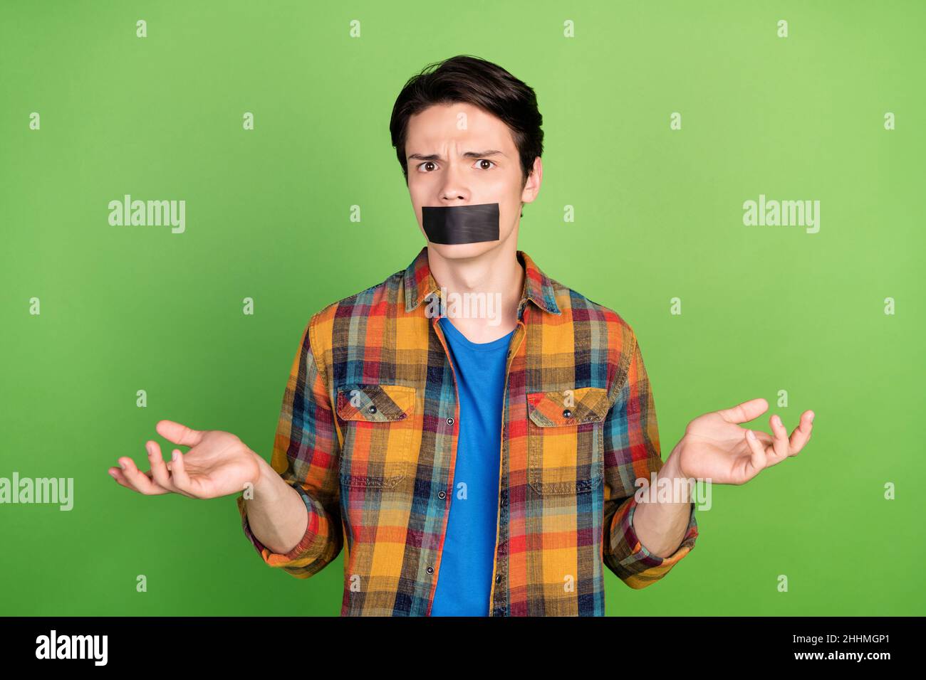 Portrait of attractive speechless clueless puzzled guy with sticker ...