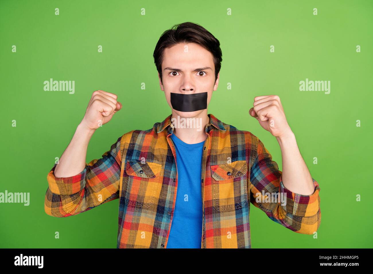 Portrait of attractive speechless guy struggling freedom speech human ...