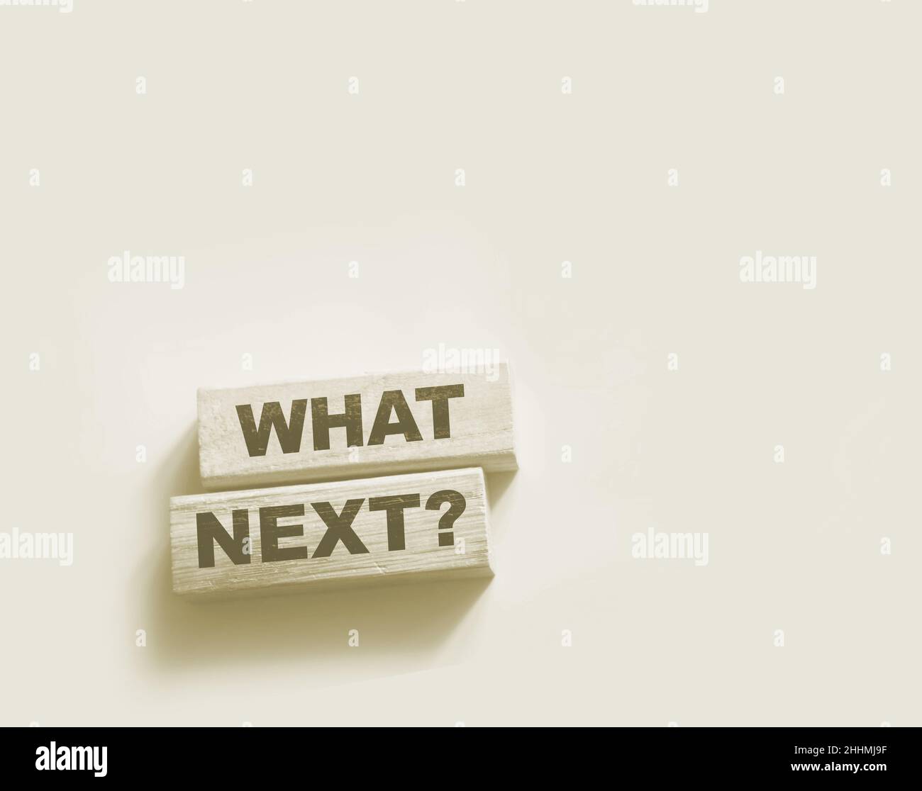 The words What Next on wooden blocks, close up shot, view from above ...