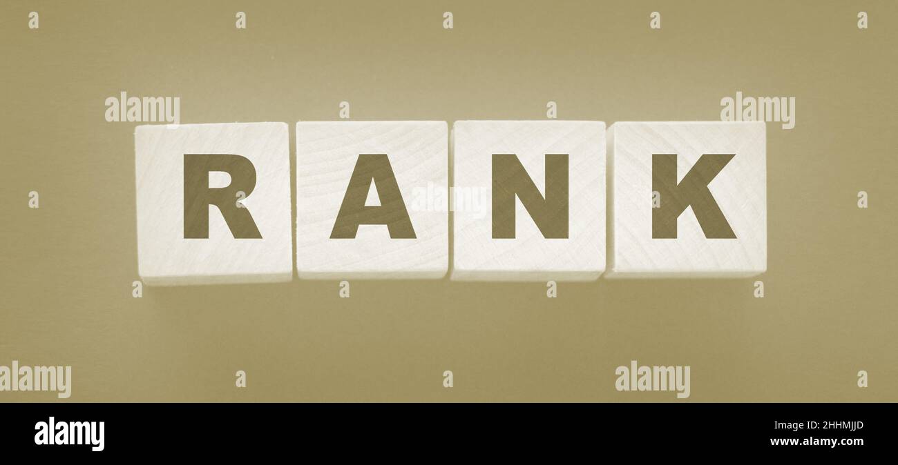 RANK text on a black background on wooden cubes. Ranking SEO concept ...